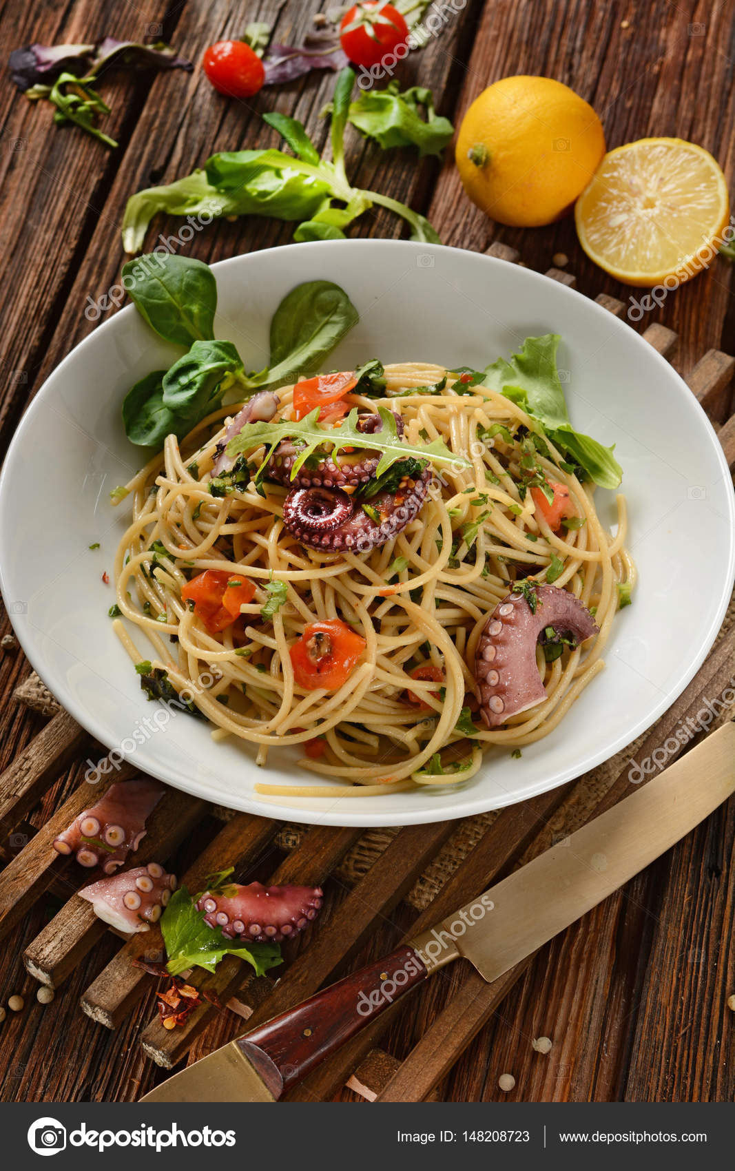 Spaghetti with octopus, tomatoes and assorted herbs - Italian fo ...