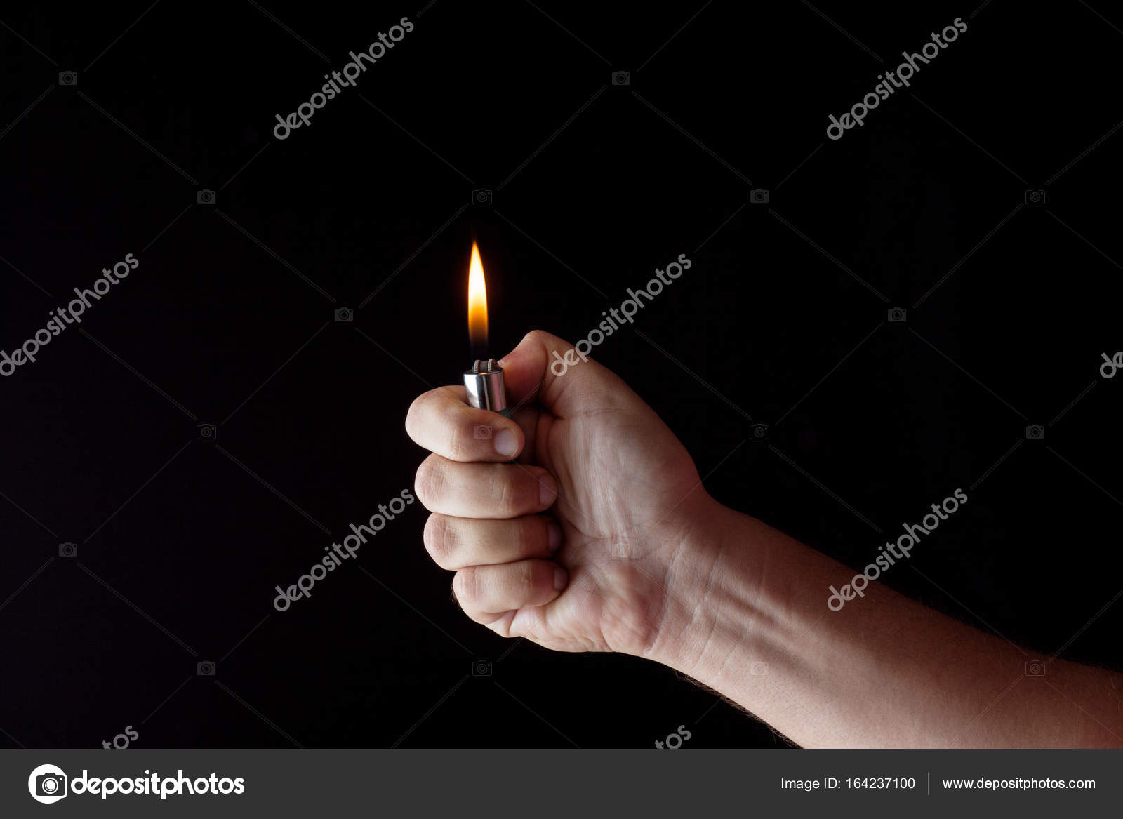 Hand holding a lighter in a dark atmosphere Stock Photo by ©bachar ...