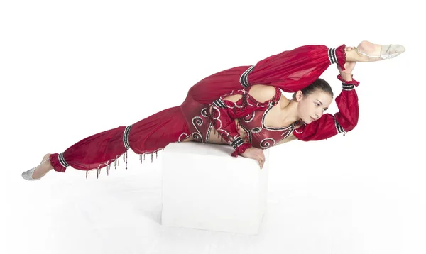 A young contortionist,circus performer in a red suit. Stock Photo by ...