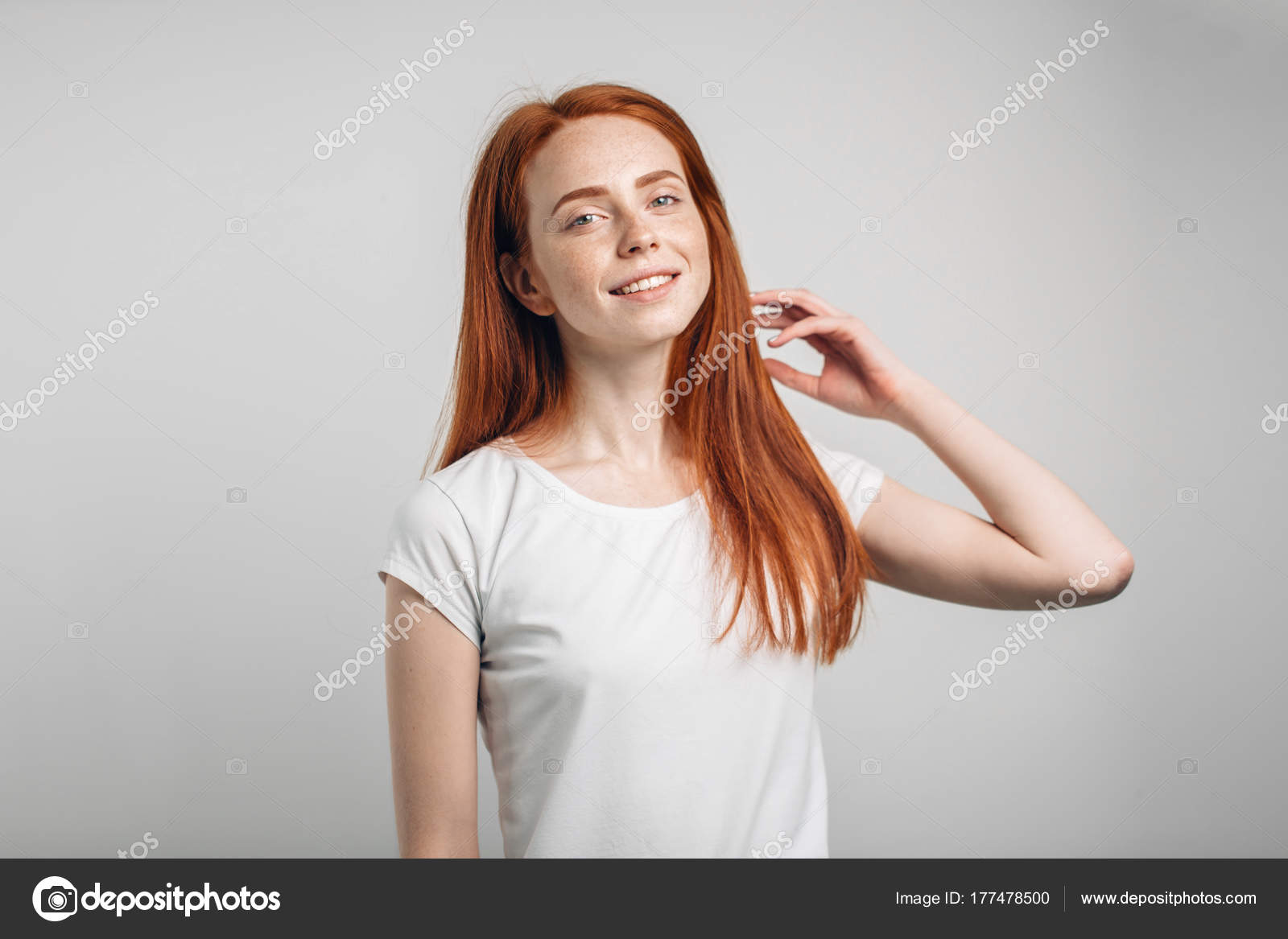 Girl smiling with closed eyes touching her red hair over white background — Stock Photo ...