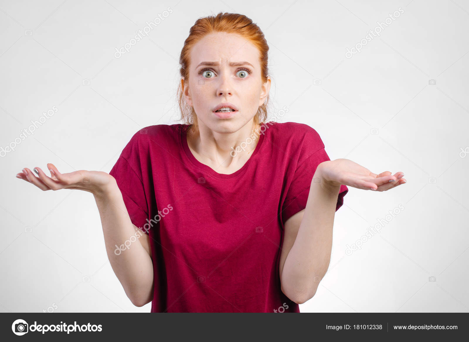 Young woman shrugging her hands Stock Photo by ©ufabizphoto 181012338