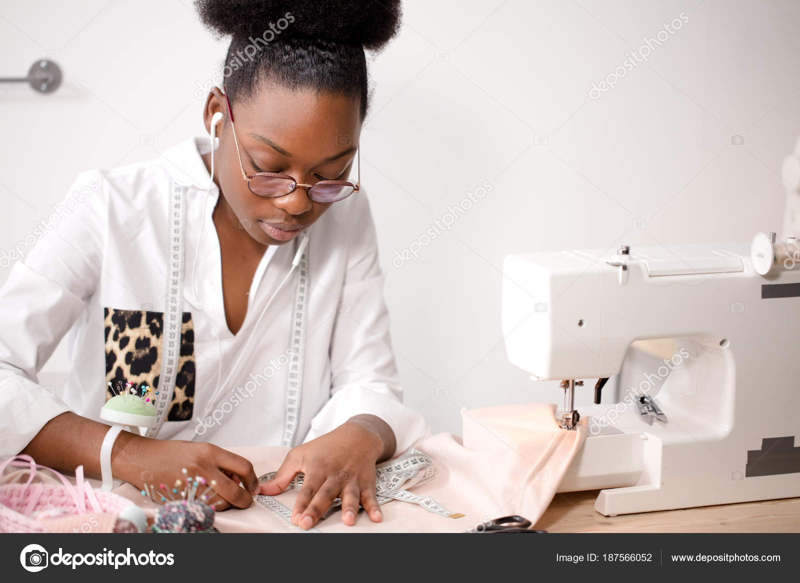 African seamstress working with fabric takes measures — Stock Photo ...