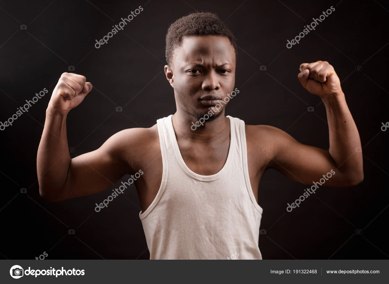 Angry athlete with serious face is practising bodybuilding. Stock Photo ...