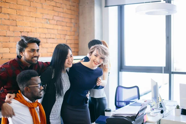 hugging team chatting online with colleagues on the Net - Stock Image ...