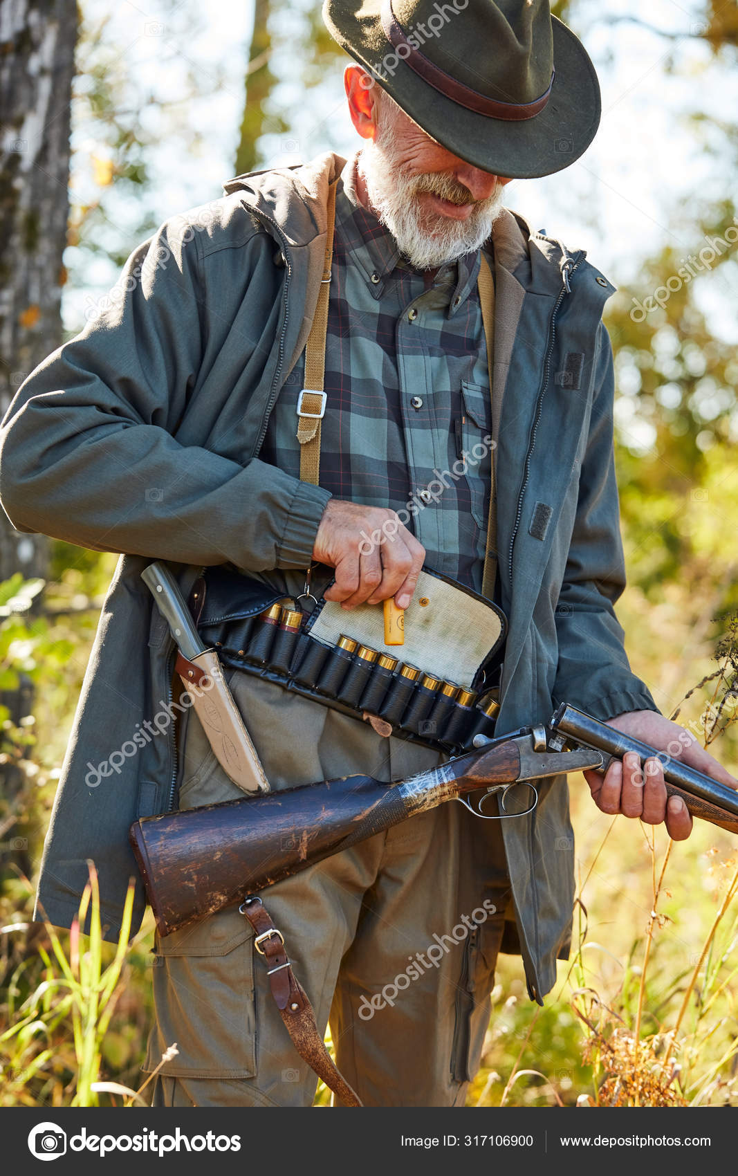 Hunter man reload the cartridge Stock Photo by ©ufabizphoto 317106900