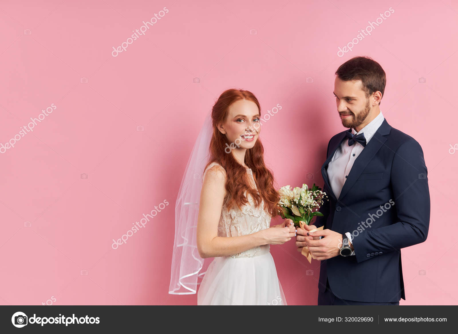 Smiling fiance and bride isolated over pink background Stock Photo by ...