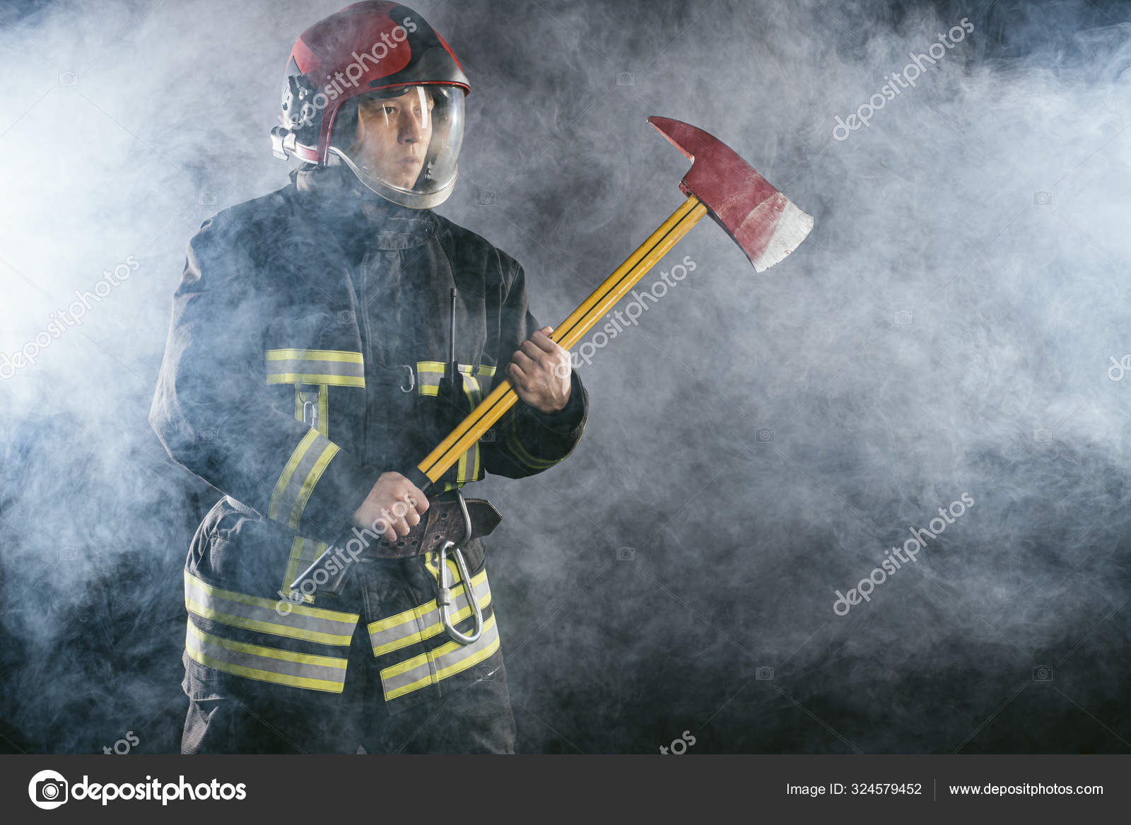 Hero man saving people from fire — Stock Photo © ufabizphoto #324579452