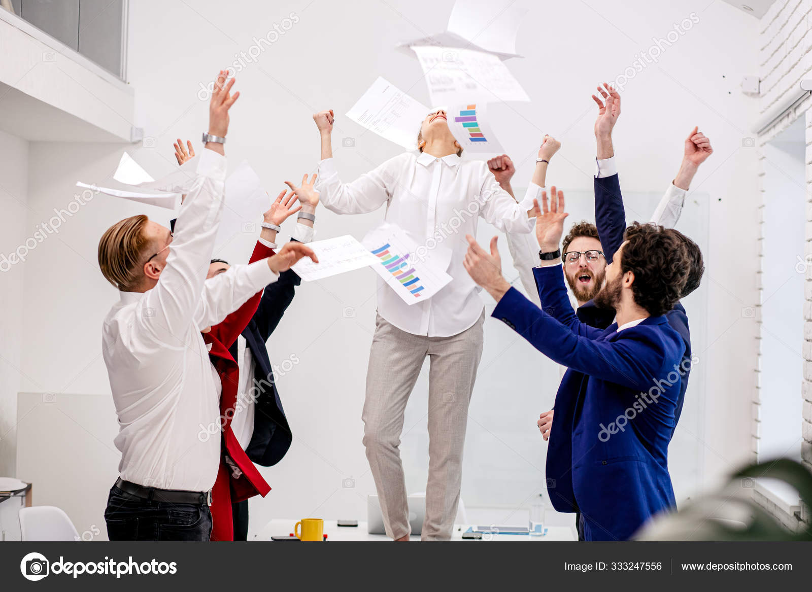Happy business team celebrating victory in modern office — Stock Photo © ufabizphoto #333247556