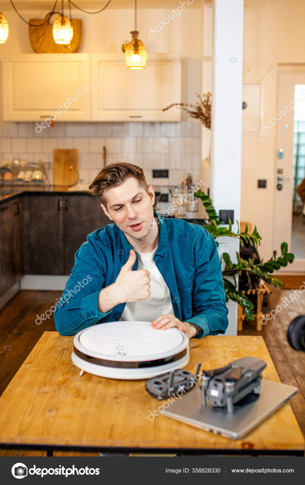 Handsome intelligent man blogger presenting device at camera — Stock ...