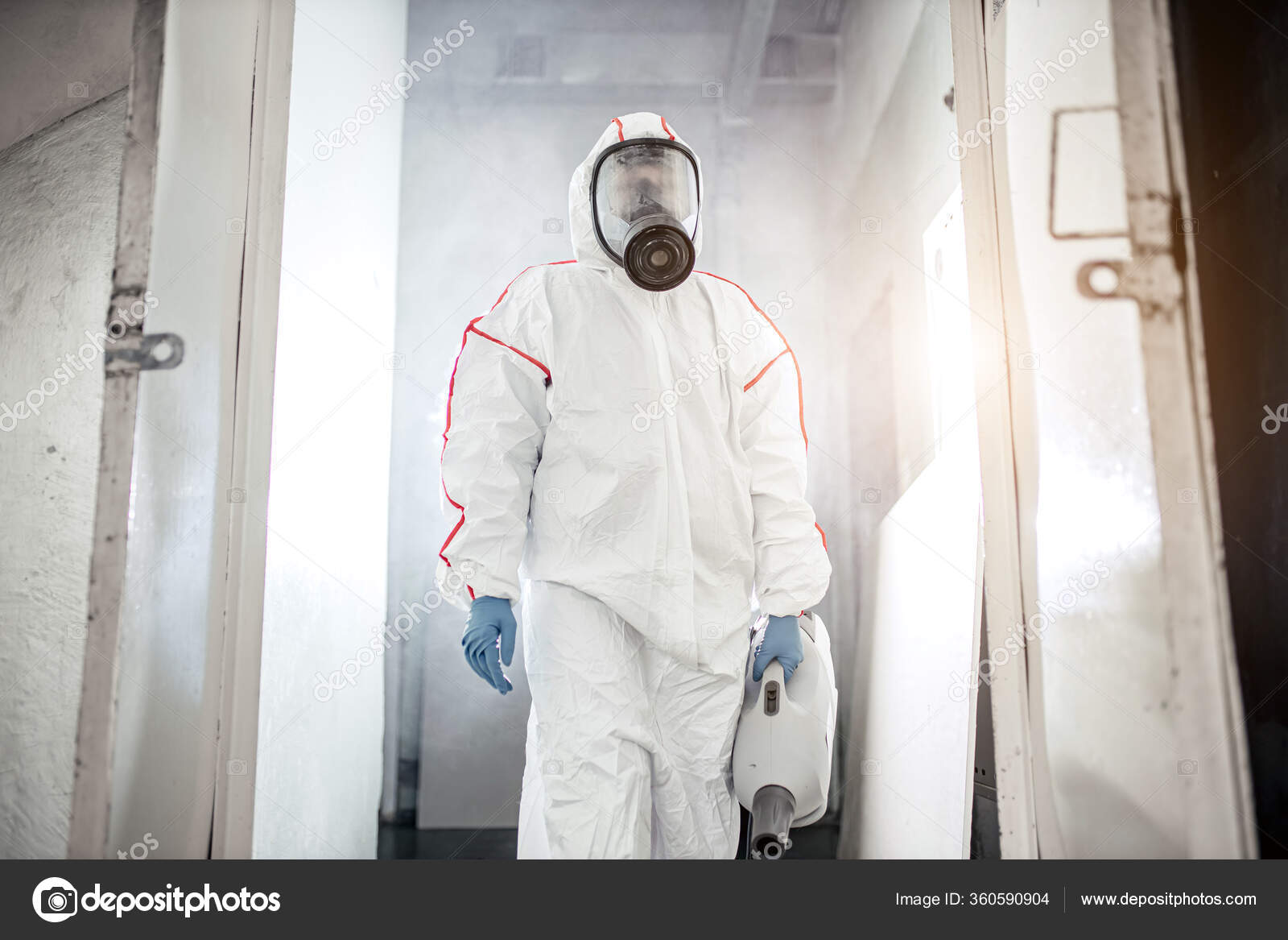 Male in protective hazmat suit and gas-mask. pathogen respiratory ...