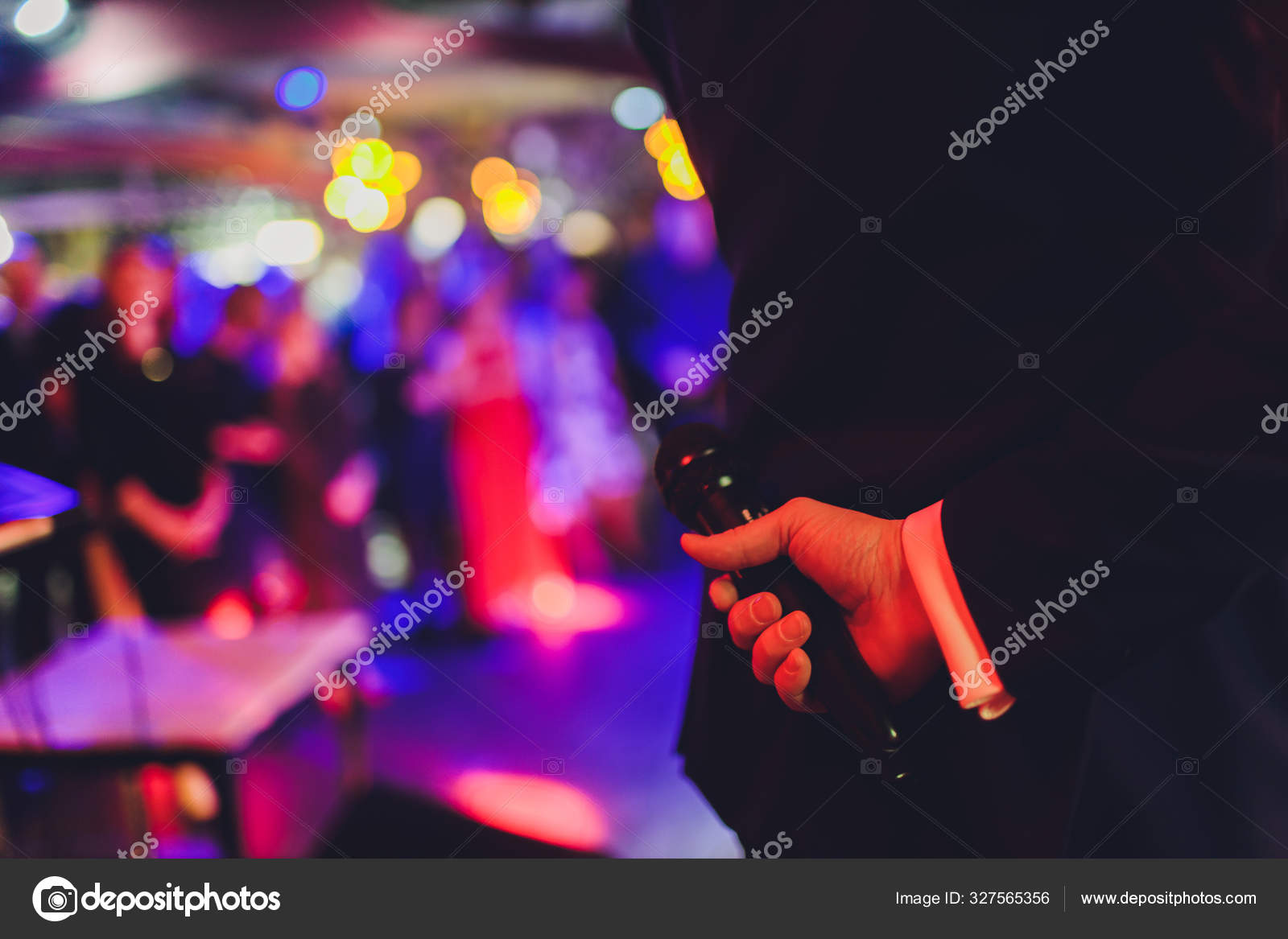 Mic Drop A microphone falling to the floor with stage lights behind ...