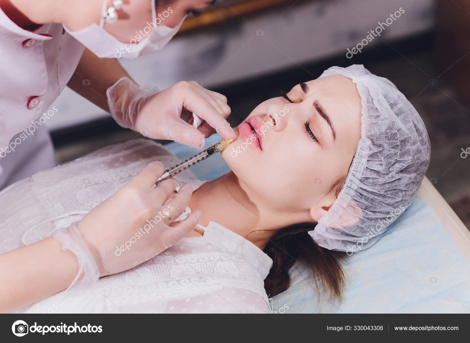 Woman receiving a injection in her lips, close up. Stock Photo by ...