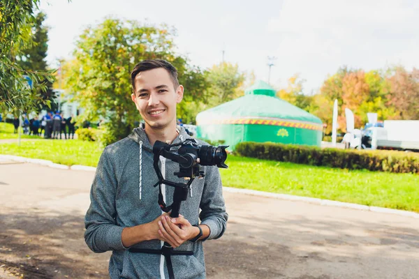 Videographer with gimball video dslr, Professional video, Videographer ...
