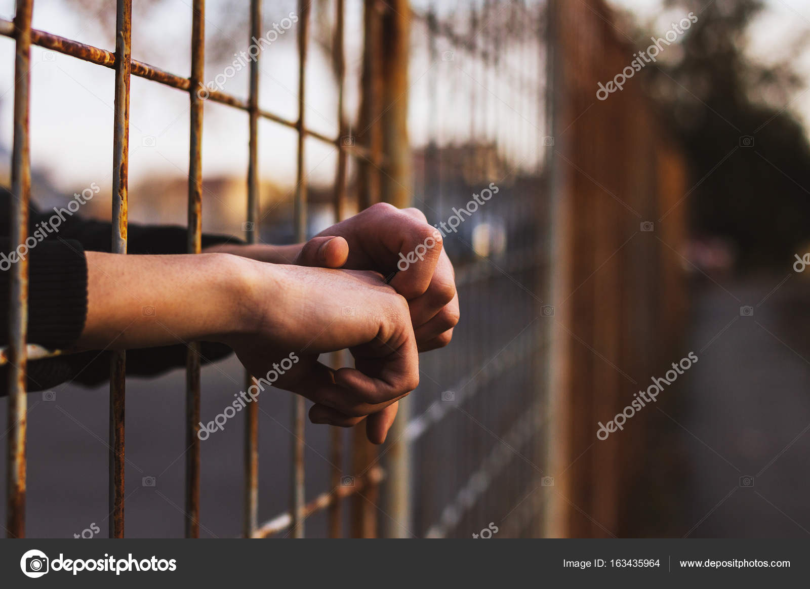 Hands sticking out through grate — Stock Photo © bnenin #163435964