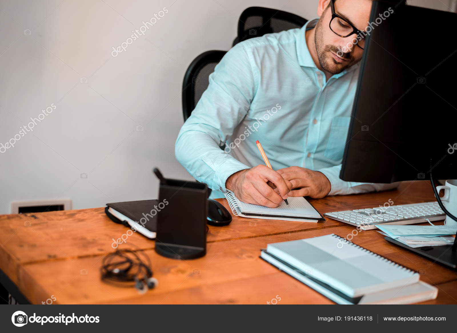 Entrepreneur Writing Notes While Sitting Office Desk Stock Photo by ...