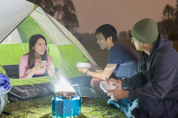 people are camping in tent - Stock Image - Everypixel