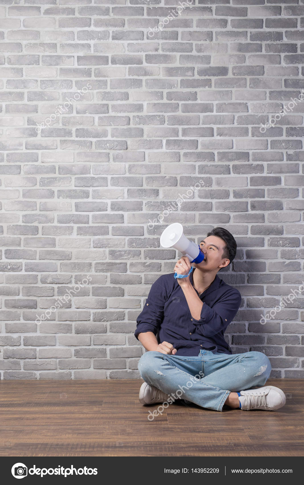Handsome man holding megaphone Stock Photo by ©ryanking999 143952209