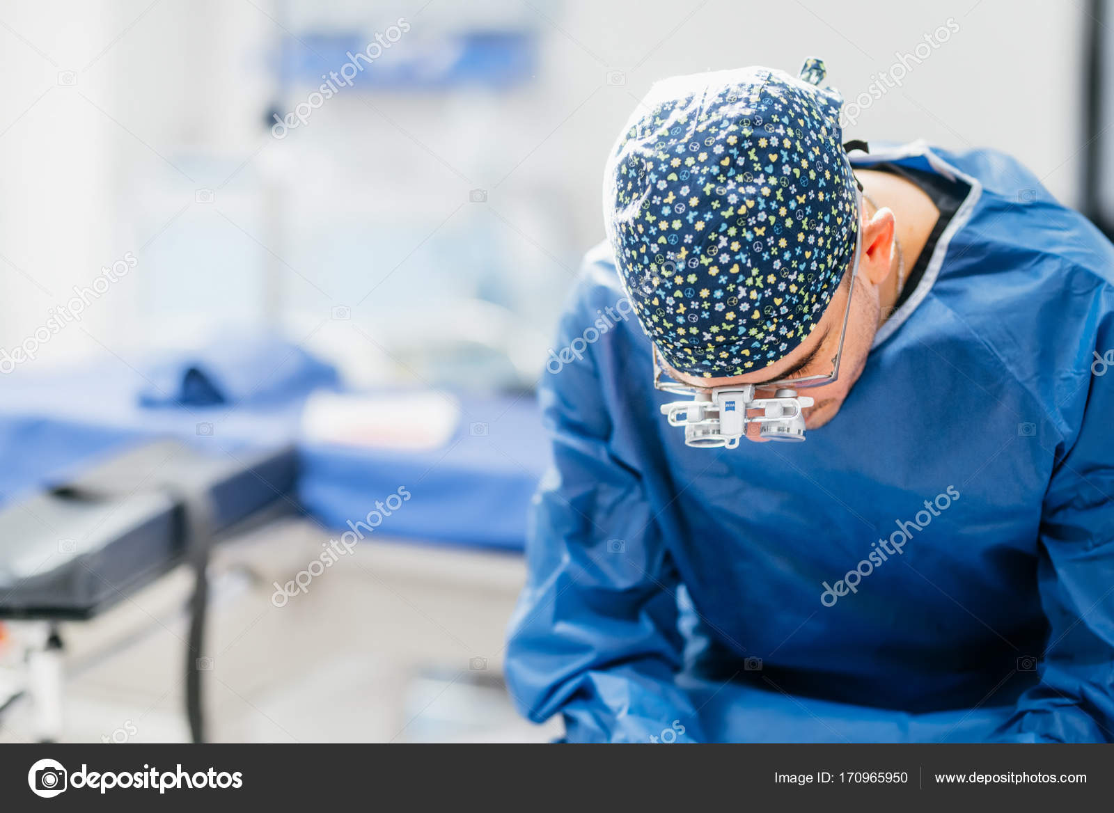 Young male surgeon getting ready for first operation. Cardiac ...