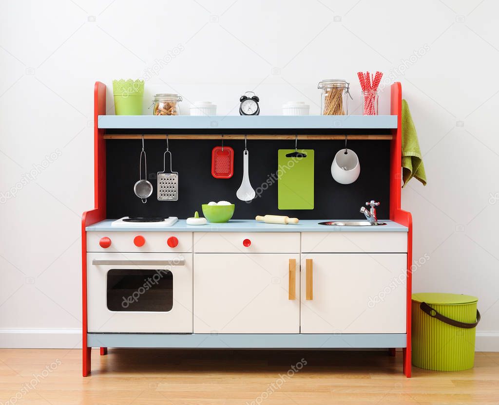 Colorful play kitchen with kitchen utensils ready for children play ...