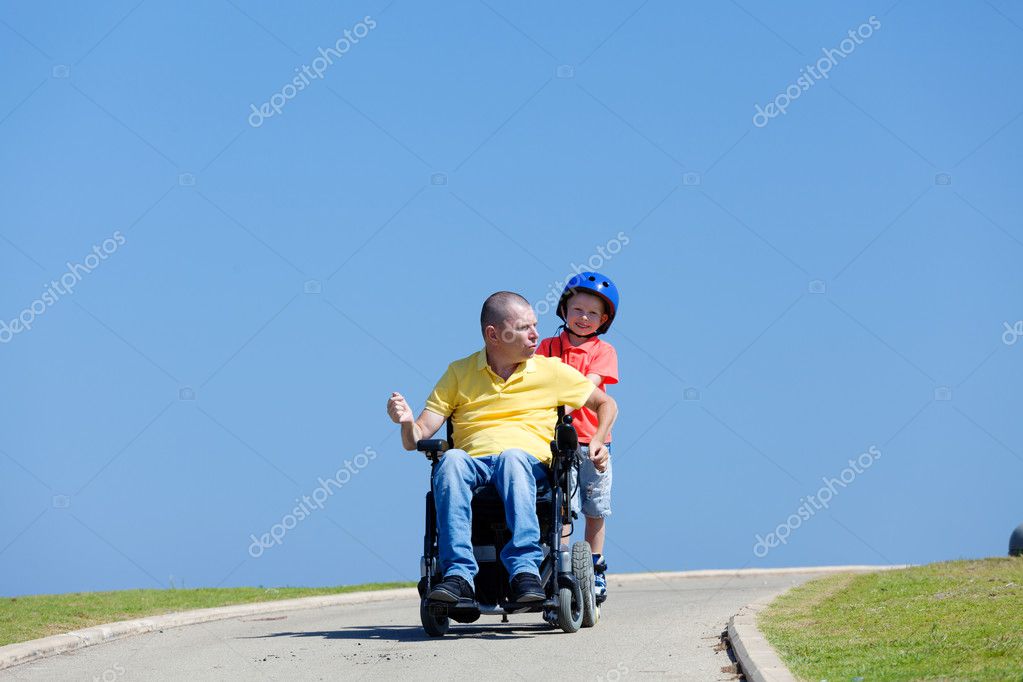 Disabled Father play with his little son Stock Photo by ©kraevski 125776392