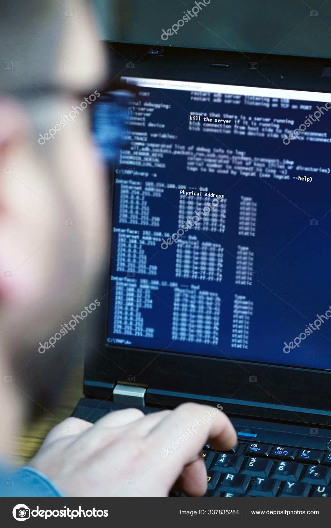 Hacker using laptop. Lots of digits on the computer screen Stock Photo ...