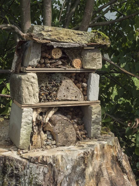 Home made insect hotel decorative bug house from sandstone and wood ...