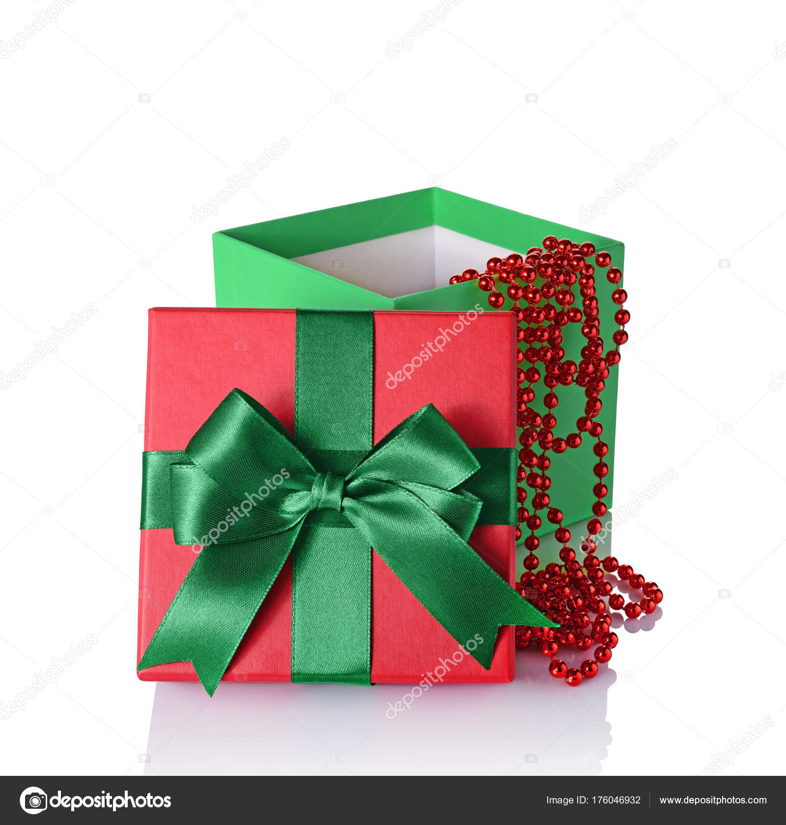 Green classic open gift box with red satin bow and beaded garland Stock ...
