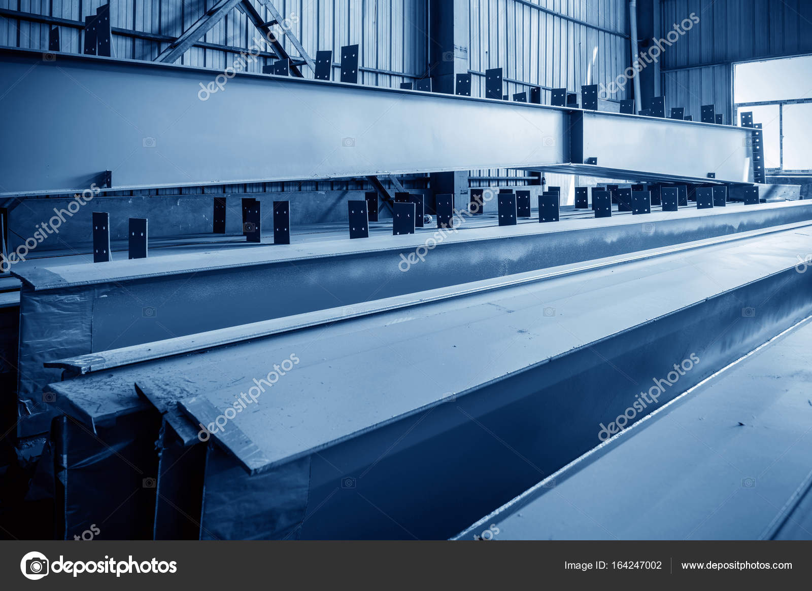 Large steel factory warehouse Stock Photo by ©gyn9037 164247002