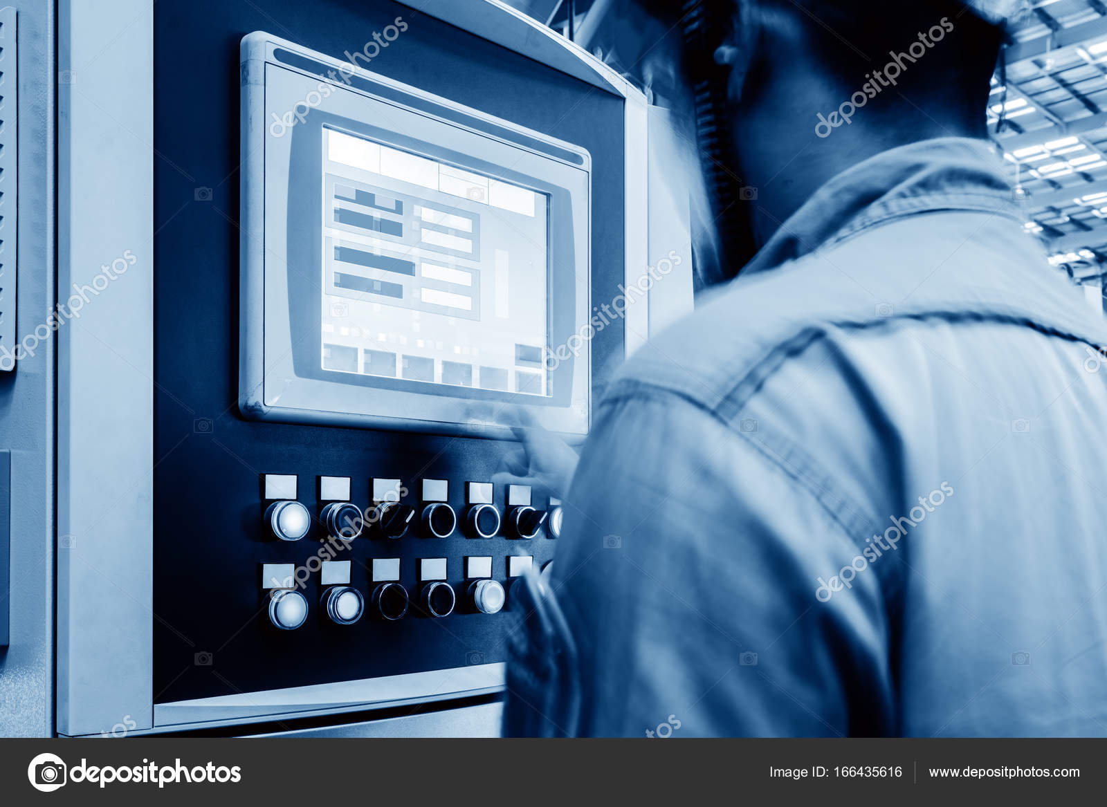 The technician is operating the production line controller — Stock ...