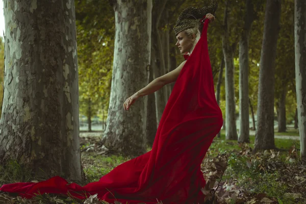woman posing in helmet and cape - Stock Image - Everypixel