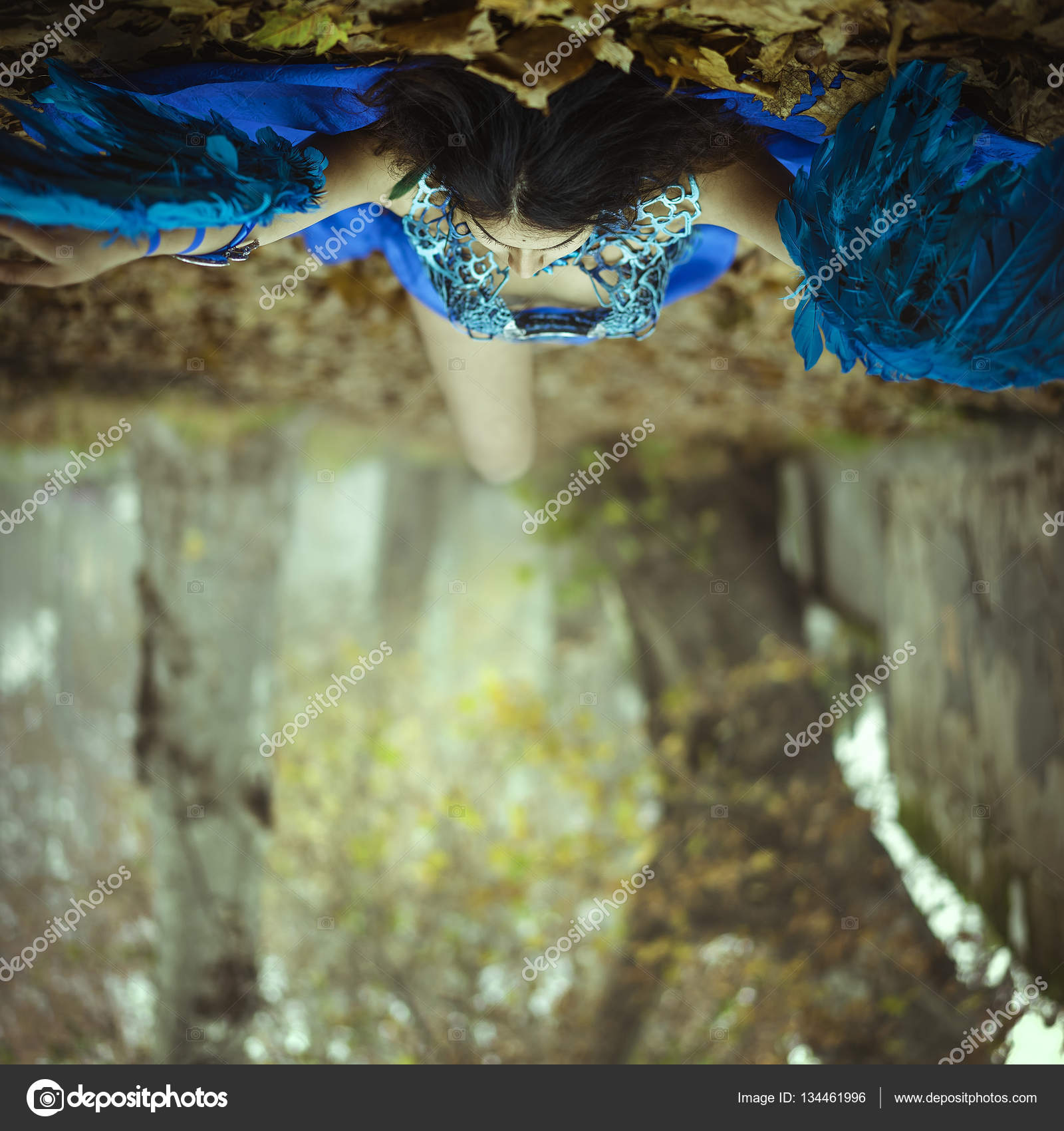Fallen angel, Beautiful young woman with dress made of blue feat ...