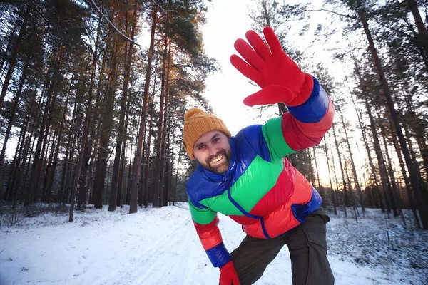 happy man winter forest waving hand gesture, winter view, extreme sport ...