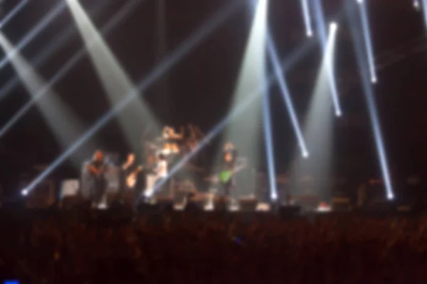 Blurry image background of musicians rock in big rock concert. Stock ...