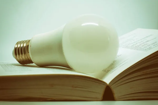 Lightbulb and book Stock Photos, Royalty Free Lightbulb and book Images ...