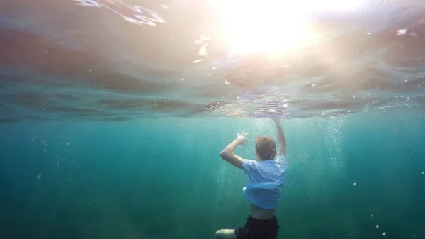Man Sinking Underwater
