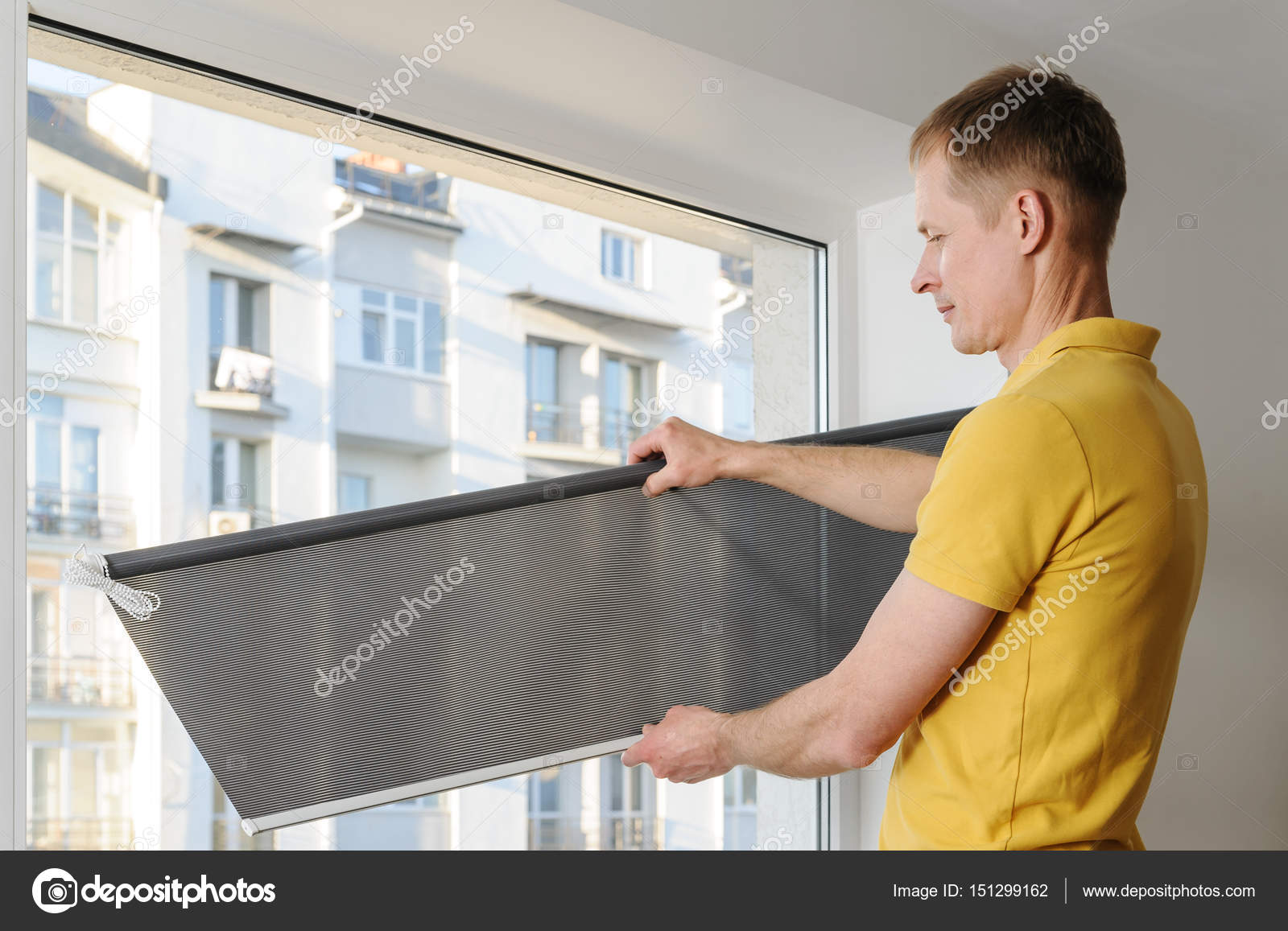 Man with window blind. Stock Photo by ©Yunava1 151299162