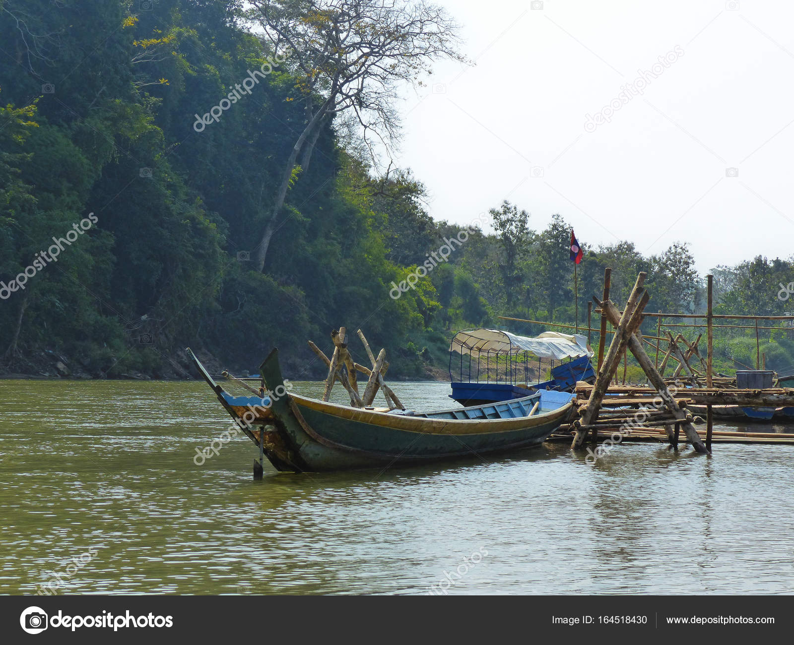 Wooden boat in 4000 thousand islands, Mekong river, Laos. — Stock Photo ...
