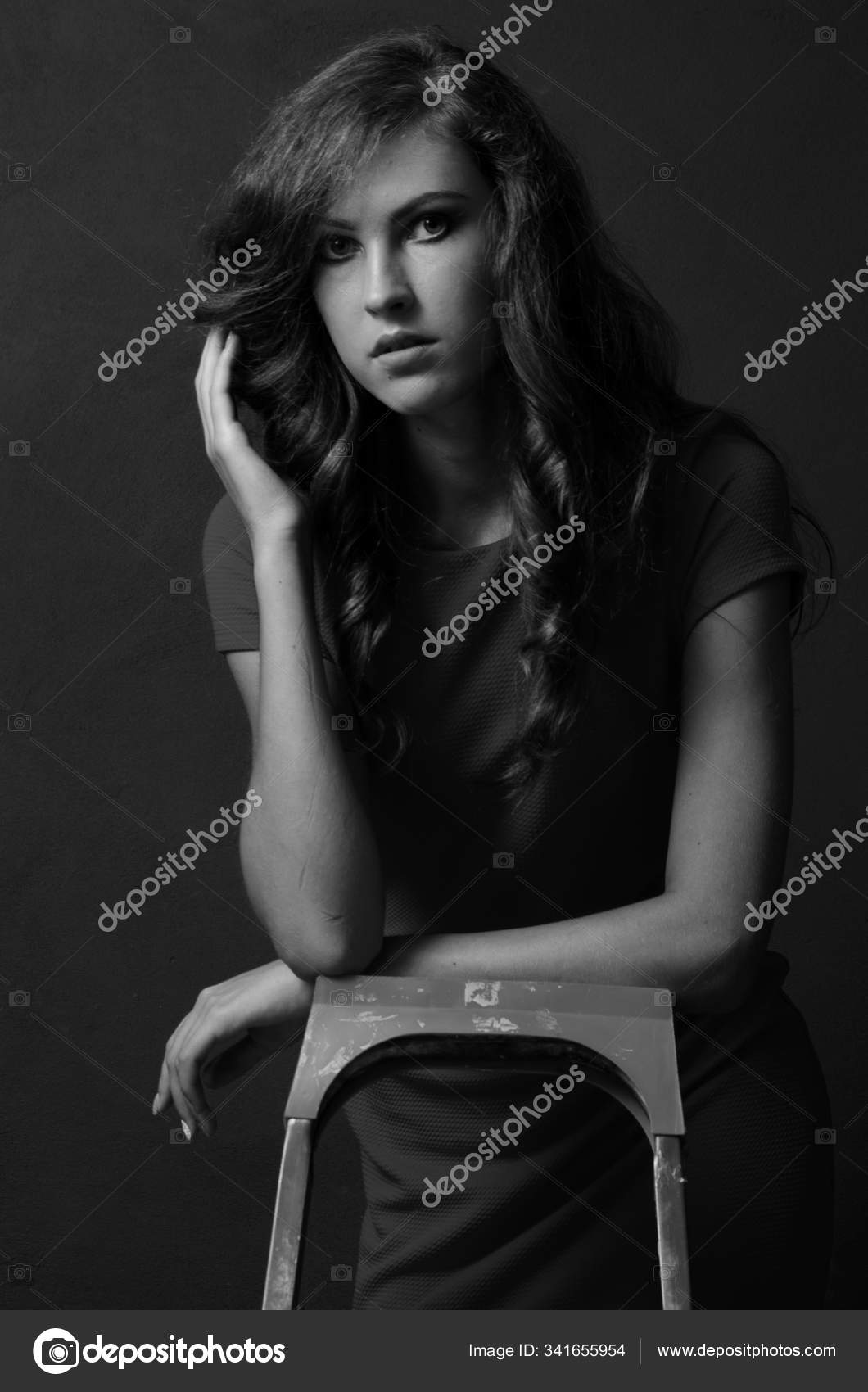 Beautiful Woman With Dark Hair And Evening Makeup Jewelry Beauty
