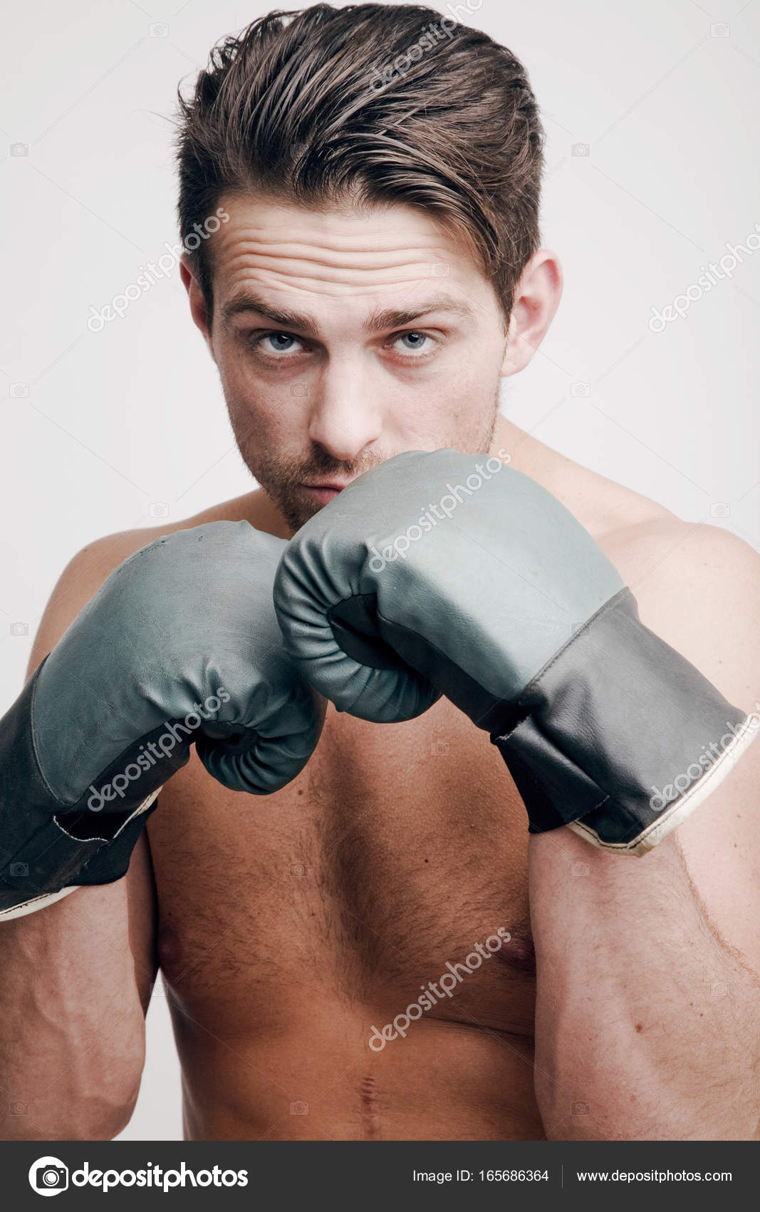 Attractive boxer with boxing gloves Stock Photo by ©dmitrybulin 165686364