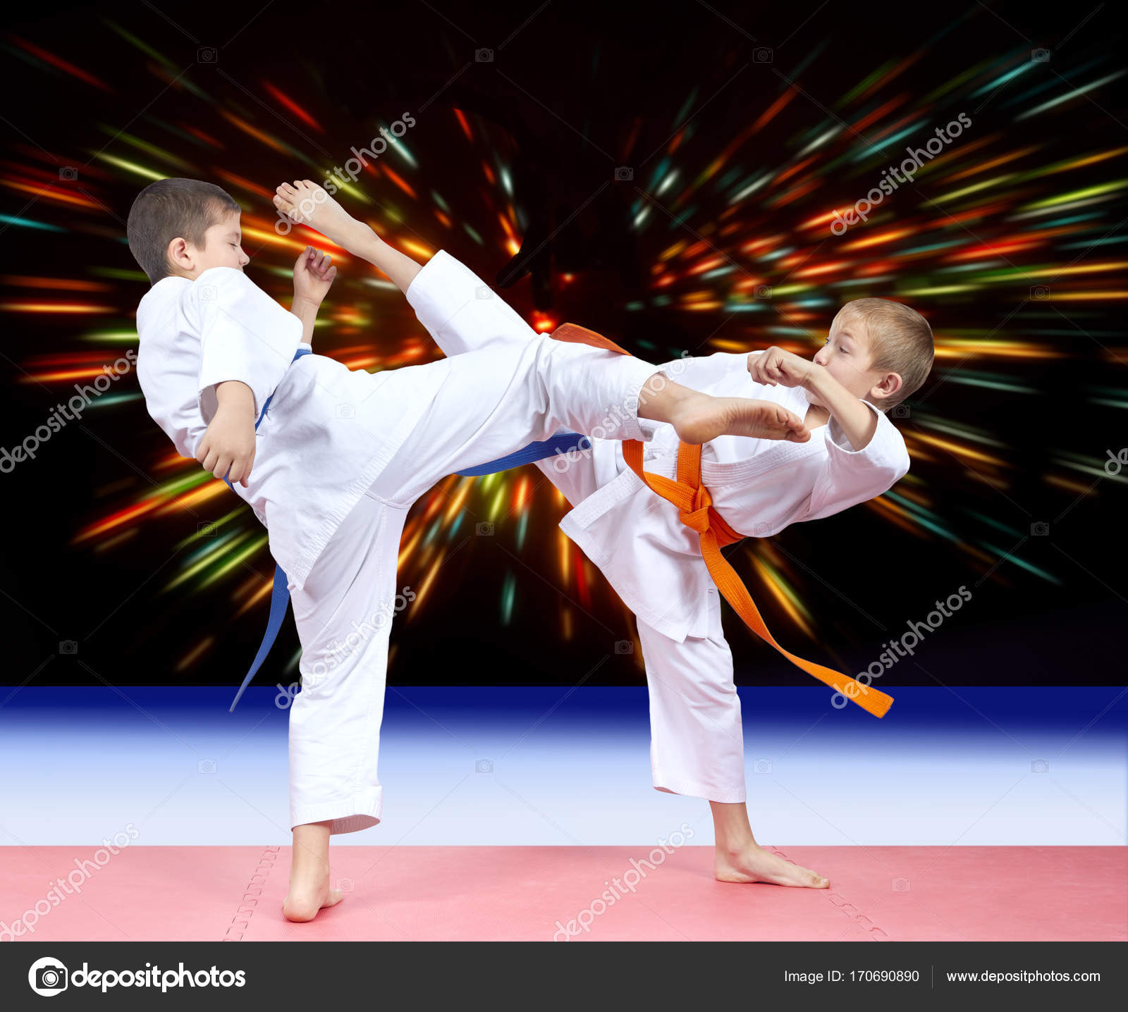 Two boys beat kicks in the background of bright rays Stock Photo by ...