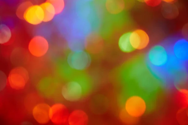 Chaotically arranged colored dots on a blurred background with the ...