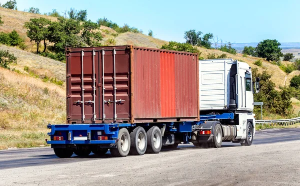 Trailer transports container on highway Stock Photo by ©Apriori 151701926