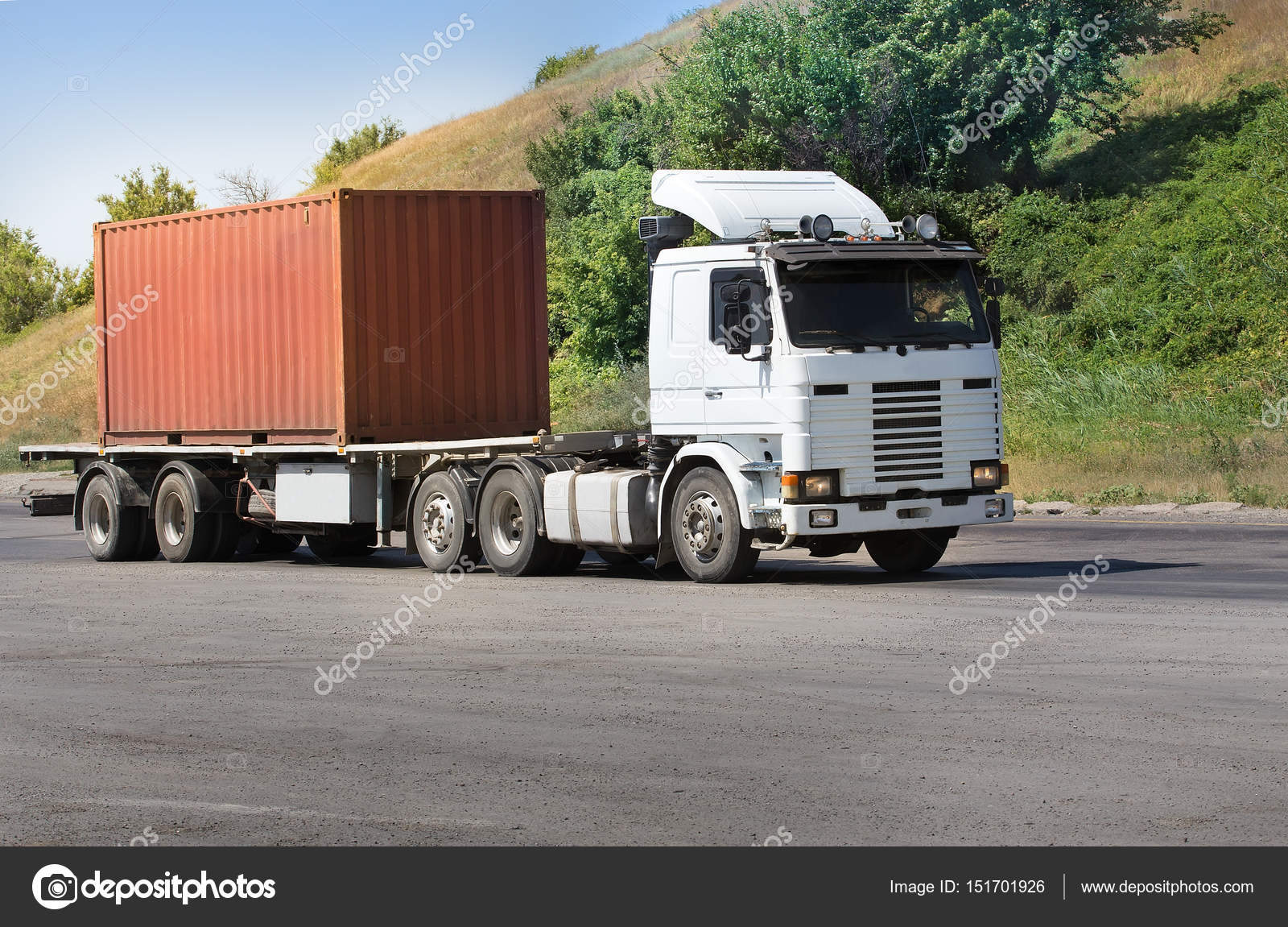 Trailer transports container on highway Stock Photo by ©Apriori 151701926