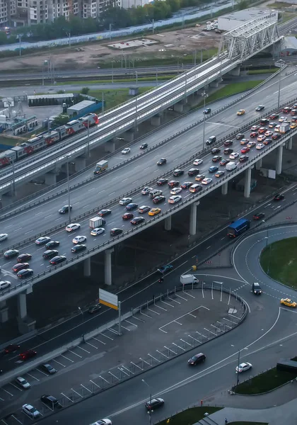 Traffic on highways in the evening in big city - Stock Image - Everypixel