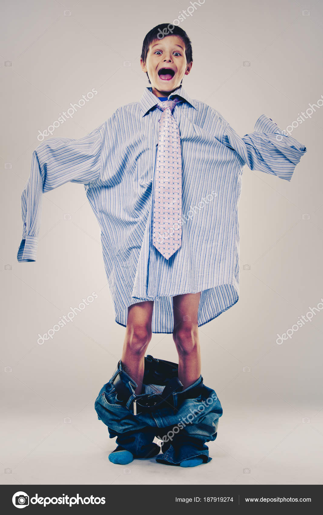 Funny boy wearing Dad's clothes Stock Photo by ©zdenkam 187919274