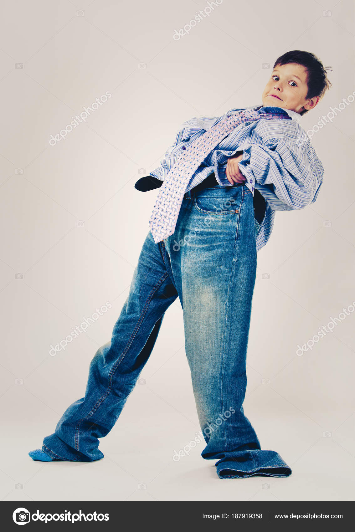 Boy Putting On Clothes