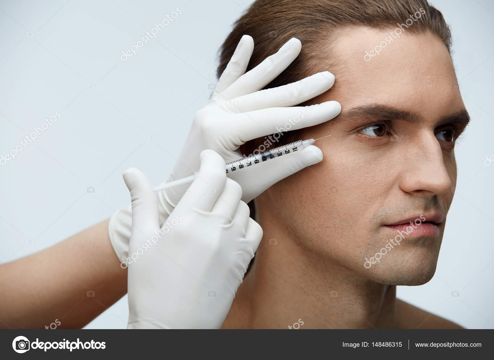 Cosmetology. Handsome Man Getting Filler Injections In Face Skin Stock ...