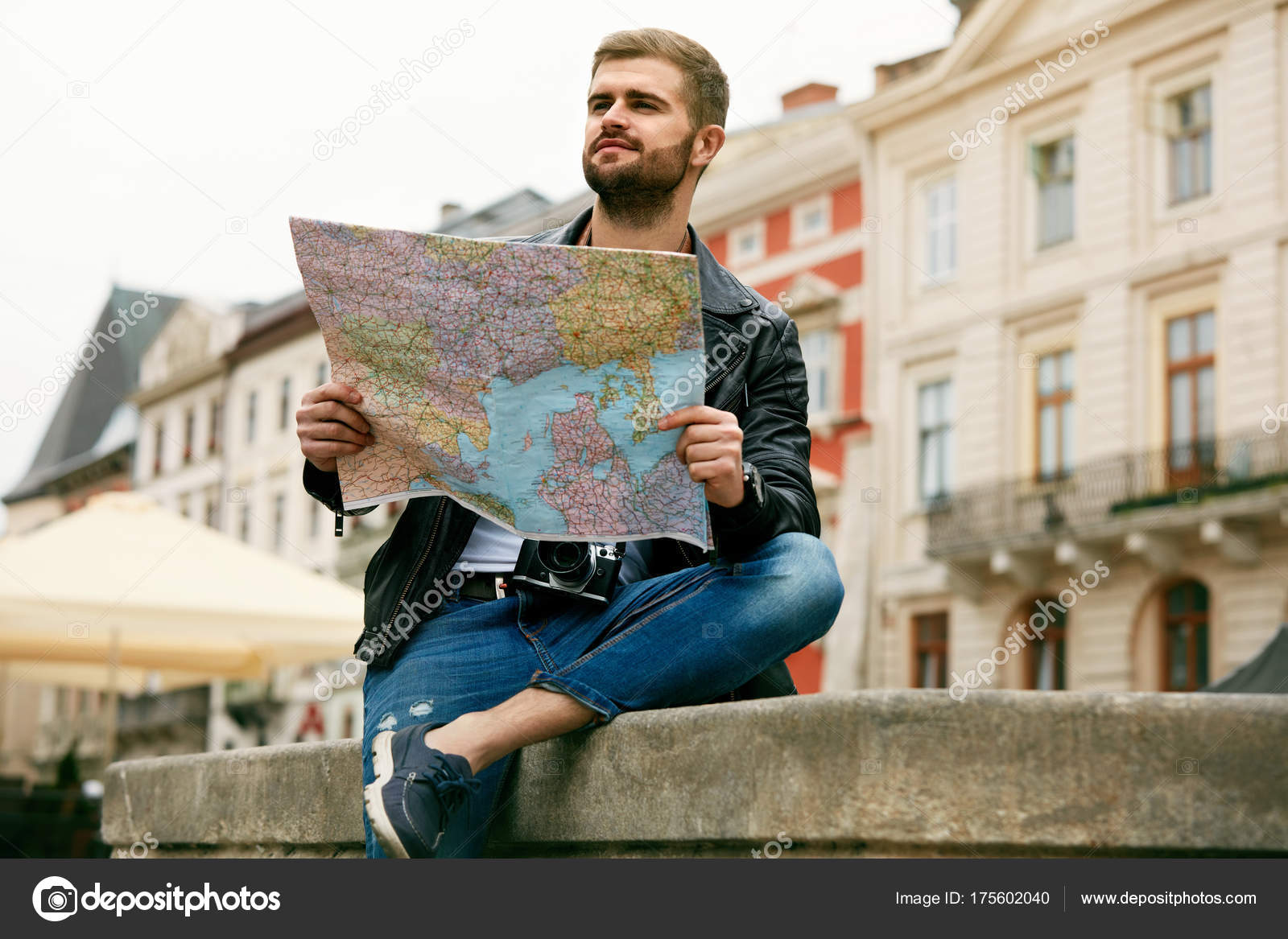 Tourist Man Reading Map On Street Portrait Stock Photo by ©puhhha 175602040