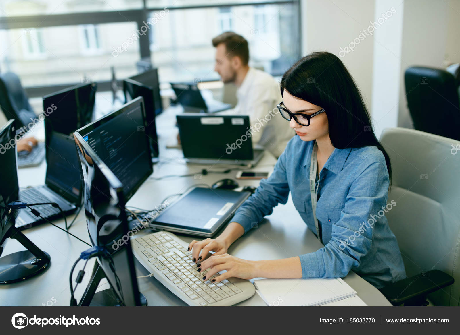 Young Woman Working And Programming On Computer In Office. Stock Photo ...