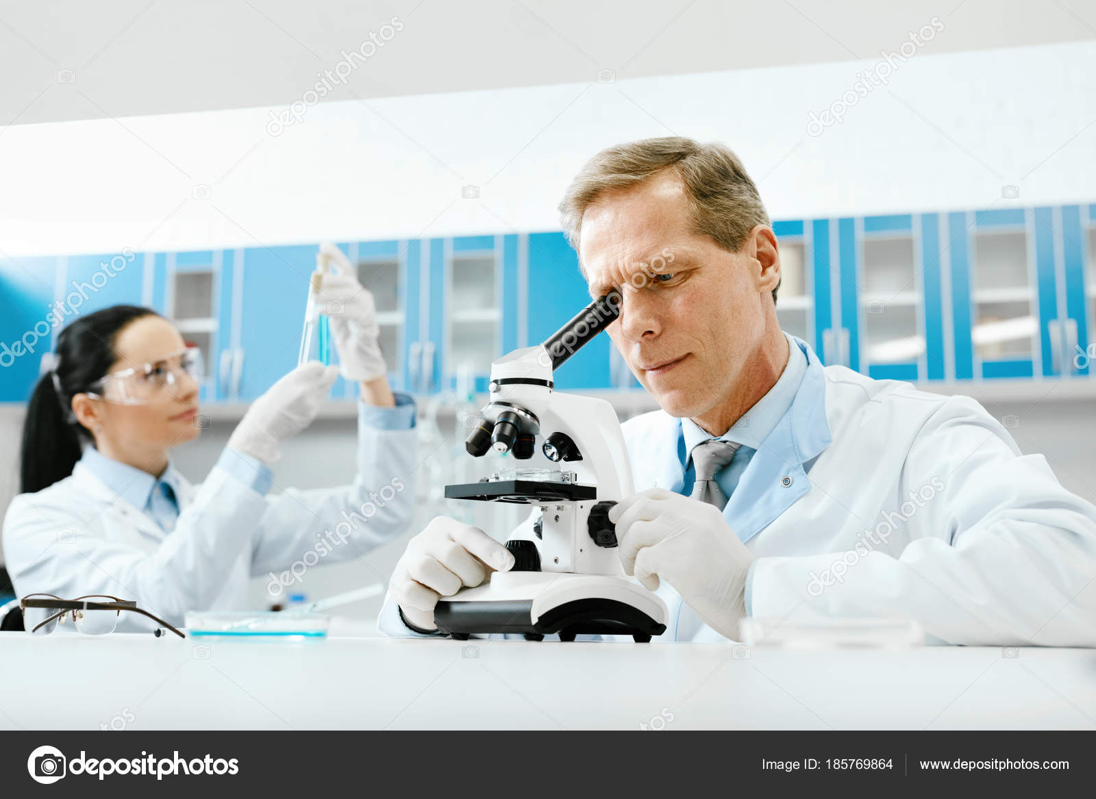 Scientists In Laboratory. Medical Workers At Work Stock Photo by ...